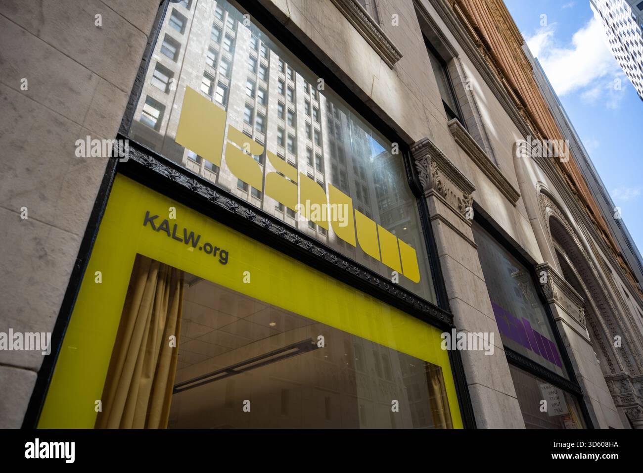 KALW public radio storefront with bright yellow window signage on ...