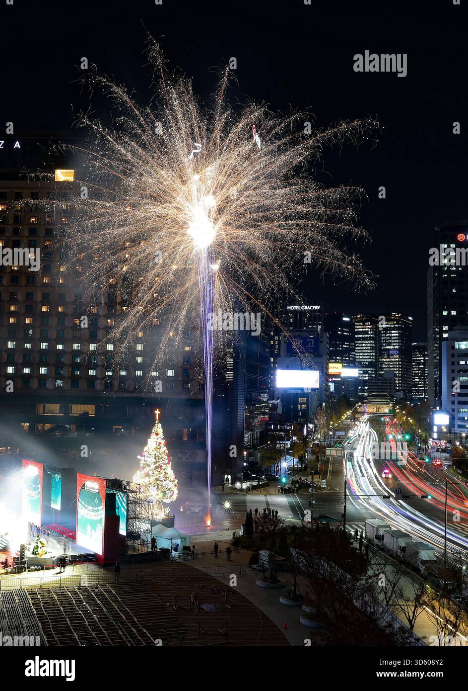 Christmas tree lighting Fireworks explode as a giant Christmas tree is lit up at the plaza in ...