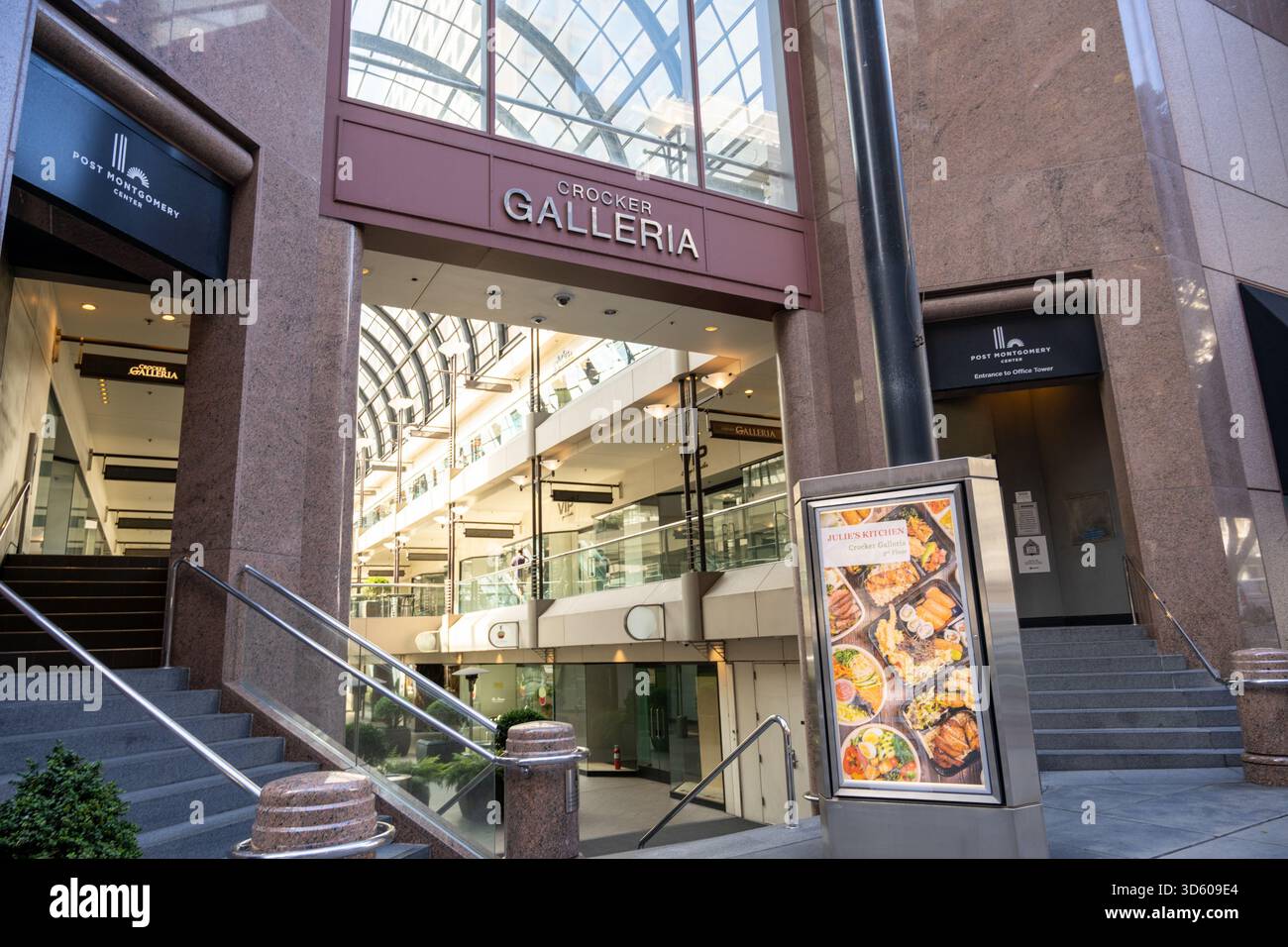 Entrance to Crocker Galleria shopping arcade with glass atrium and adjacent Post Montgomery ...