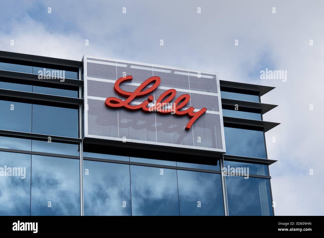 Eli Lilly logo on modern glass office building facade with partly ...
