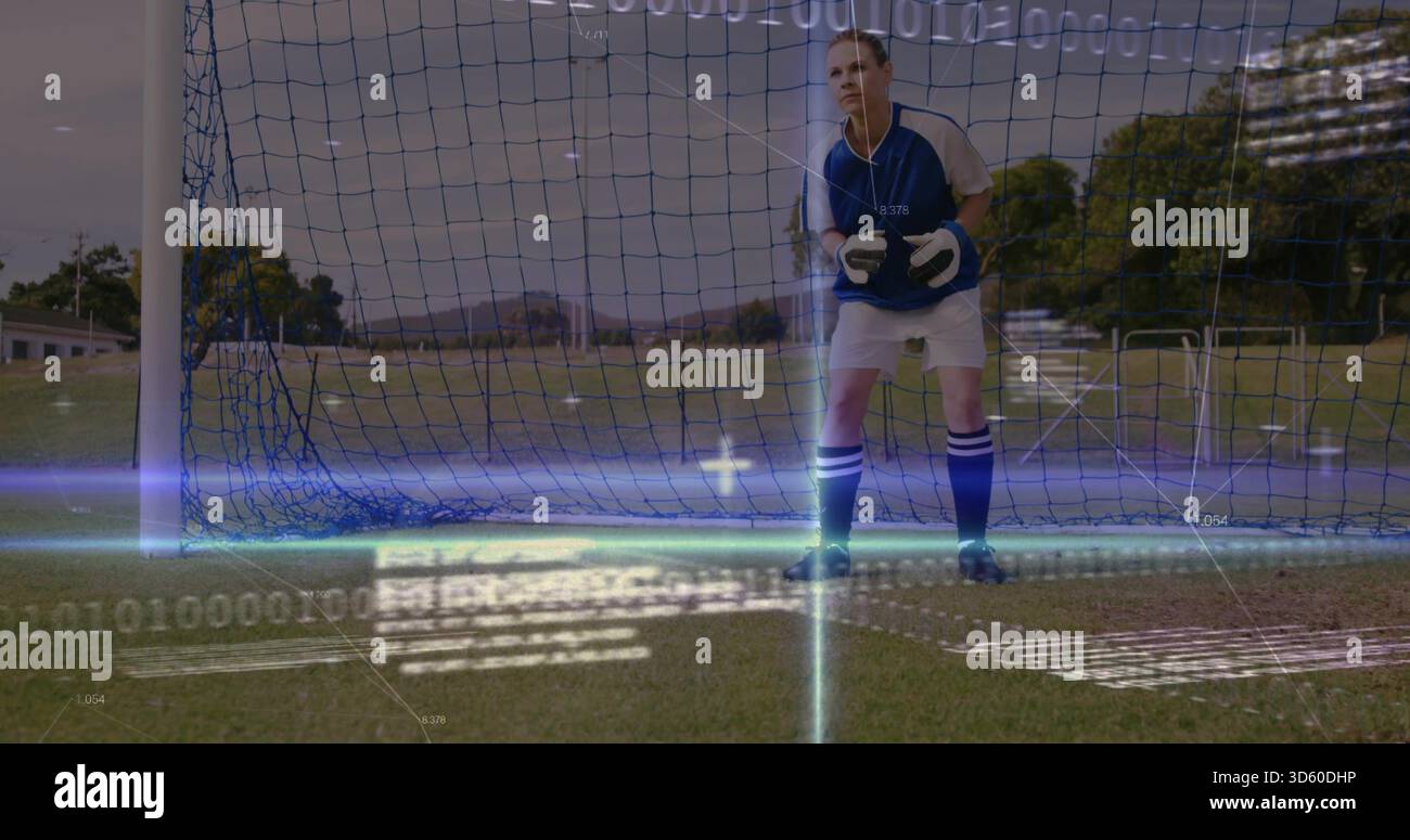 Standing goalkeeper wearing blue jersey gloves guarding soccer goal ...
