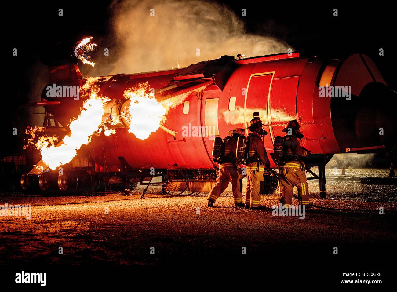 Edwards Air Force Base firefighters work together to put out a fire ...