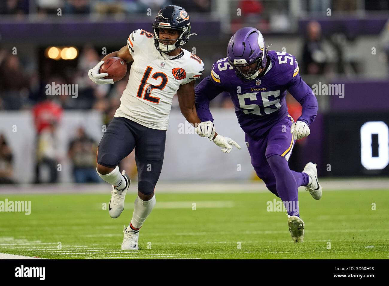Chicago Bears wide receiver Devin Duvernay (12) is pushed out of bounds ...