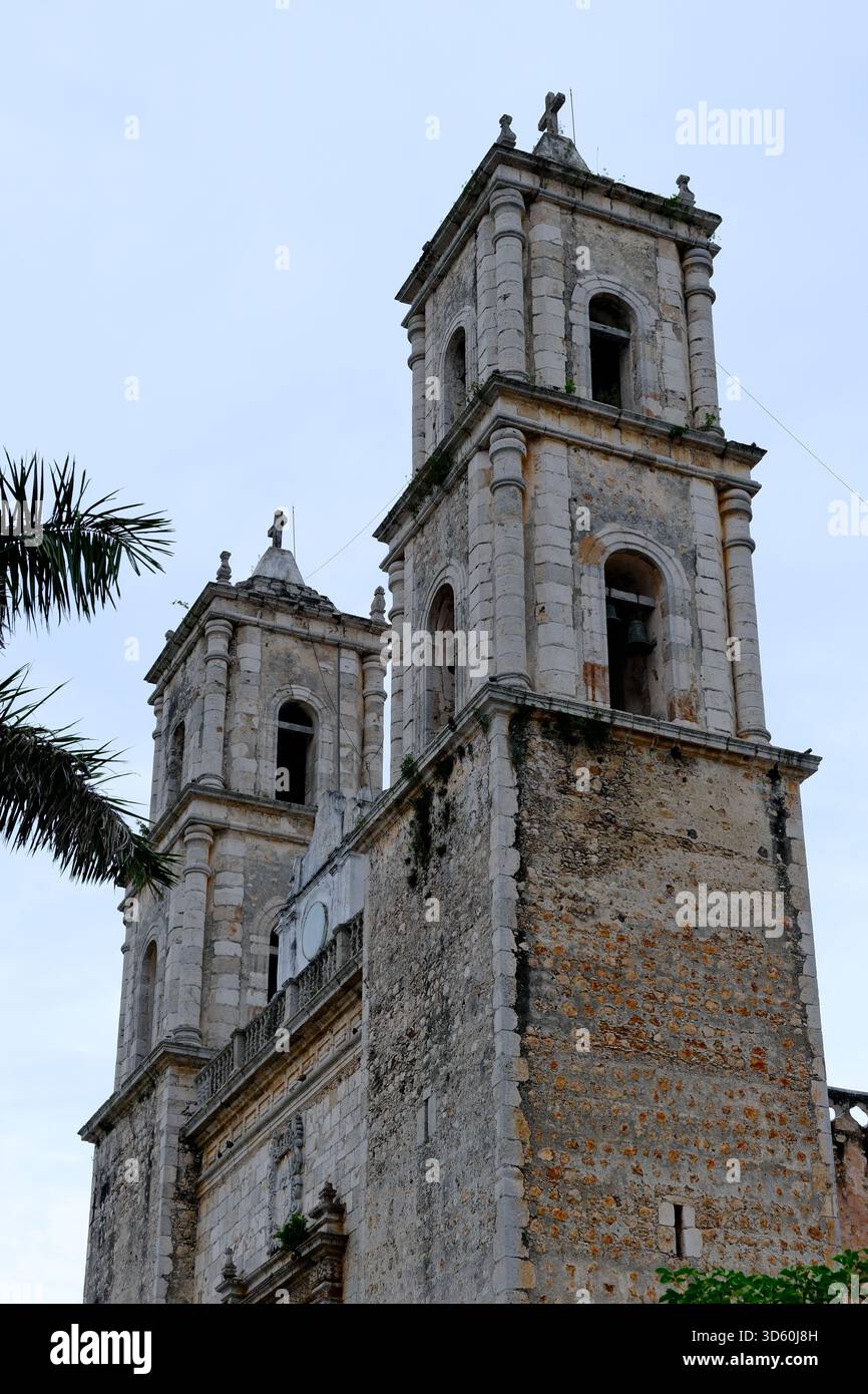 Historic stone church towers of Valladolid rising against a pale sky in ...