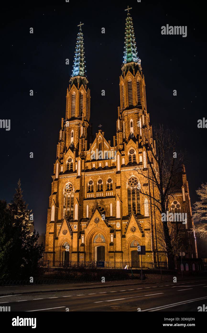 Illuminated Neo-Gothic Church at Night with Twin Towers Stock Photo - Alamy