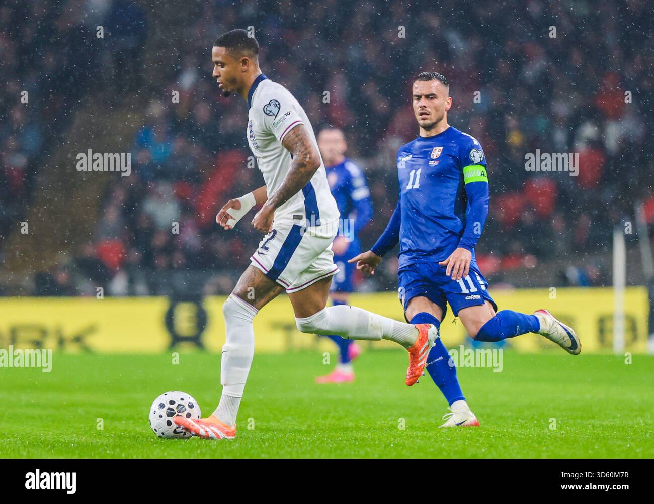 London, UK. 13th Nov, 2025. England's Ezri Konsa and Serbia's Filip ...