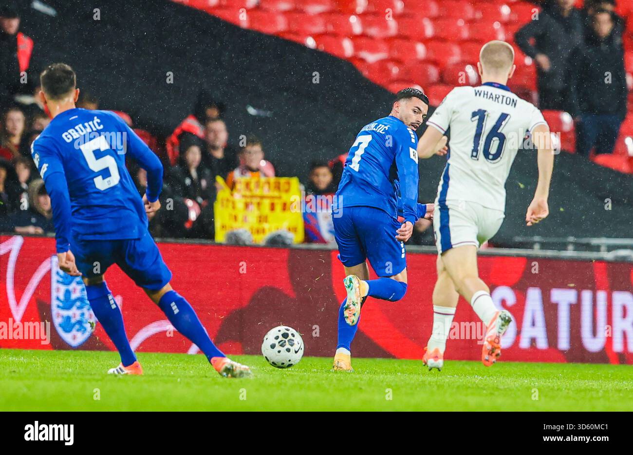 London, UK. 13th Nov, 2025. Serbia's Marko Grujic passes the ball to ...