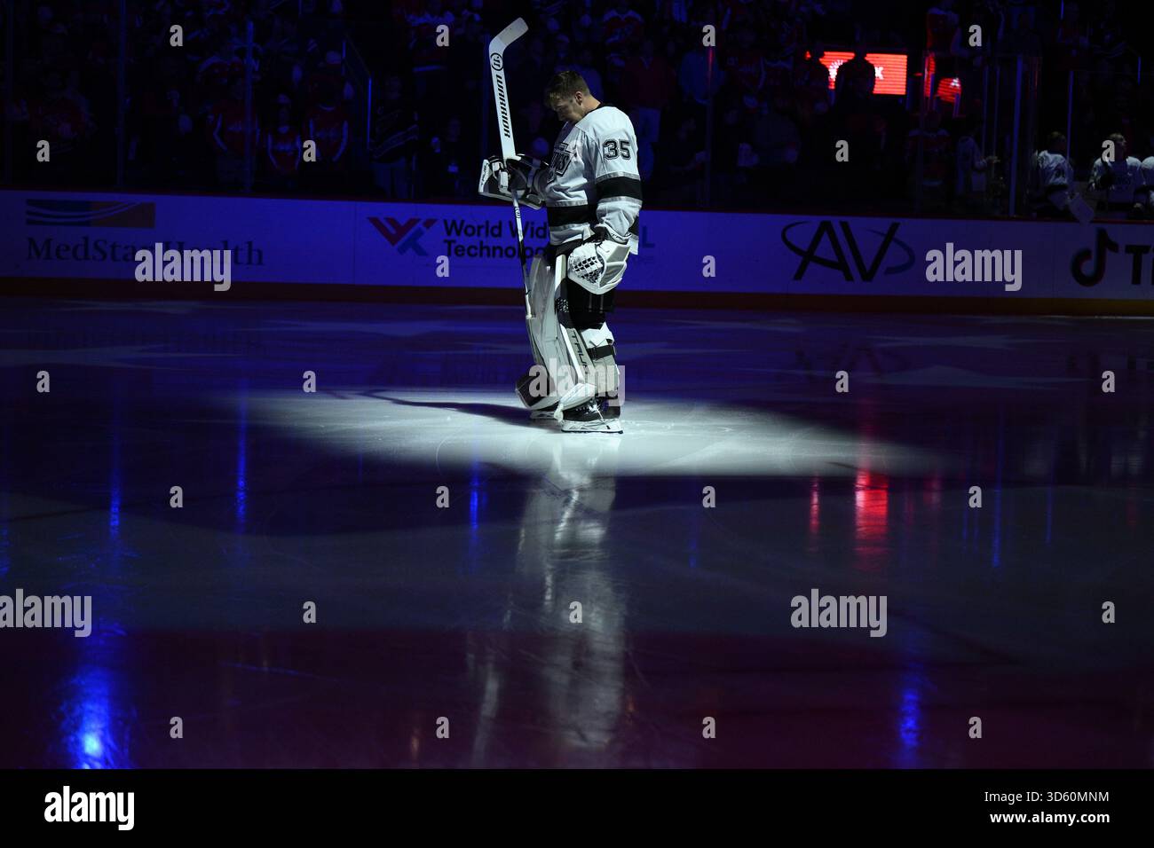 Los Angeles Kings goaltender Darcy Kuemper stands on the ice before an ...