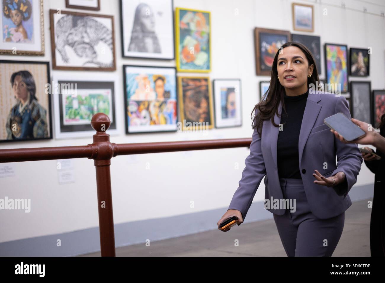 Rep. Alexandria Ocasio-Cortez (D-N.Y.) speaks with a reporter as she ...