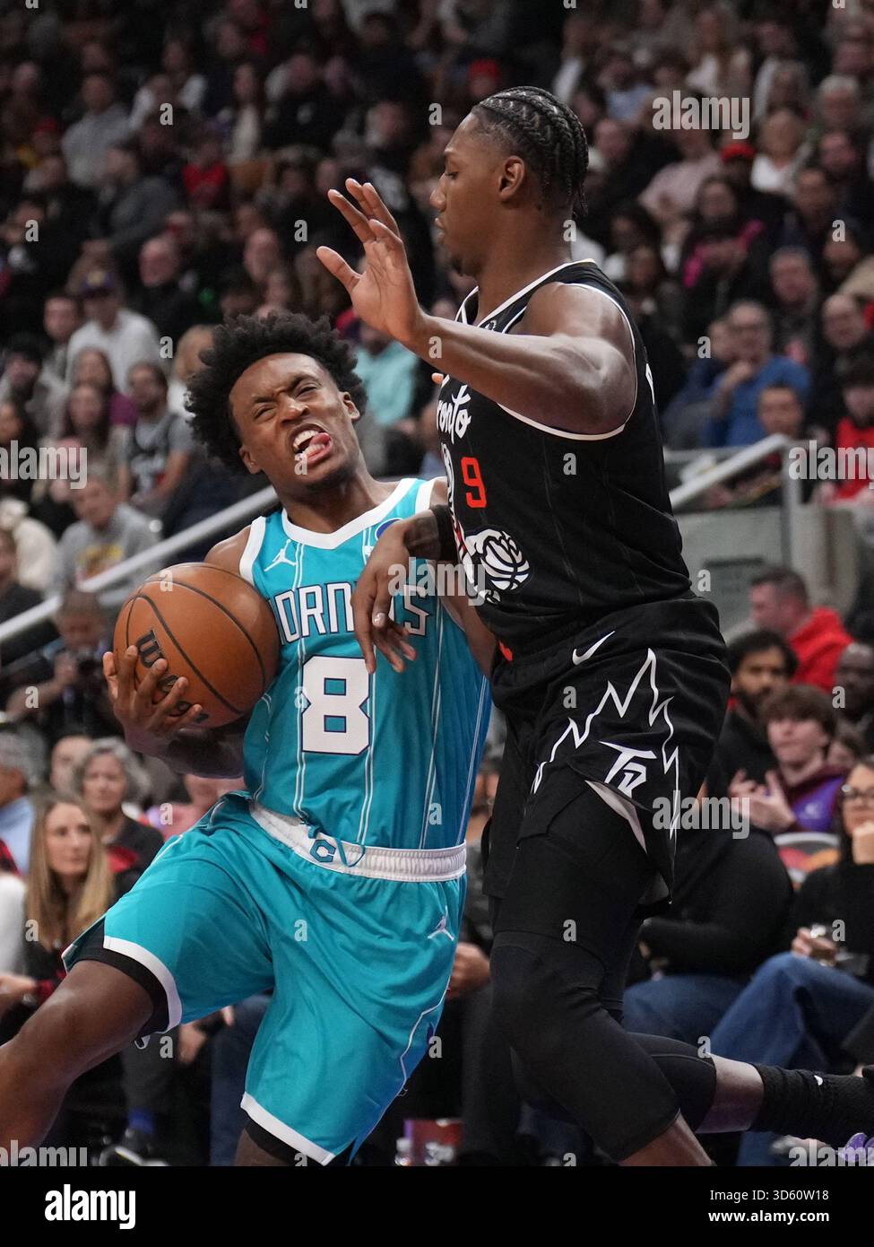 Toronto Raptors forward/guard RJ Barrett (9) fouls Charlotte Hornets ...