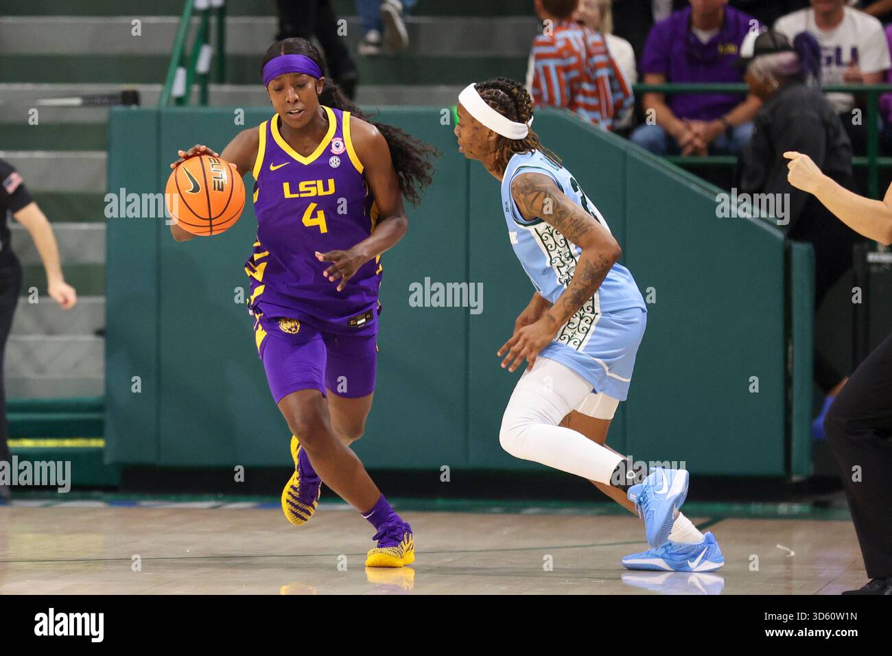 LSU Tigers guard Flau'Jae Johnson (4) tries to get past Tulane Green ...