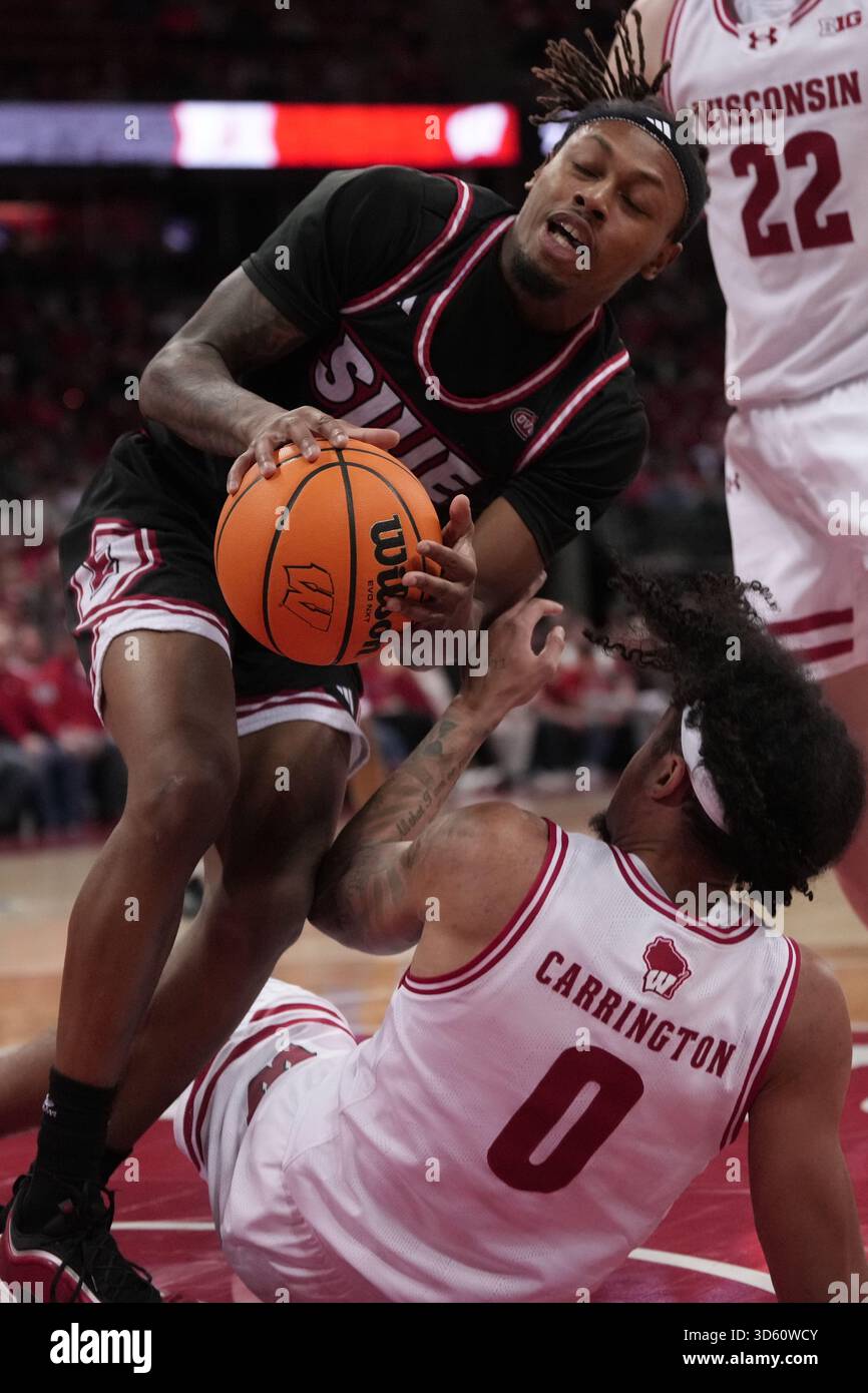 SIUE's Jo Valrie tries to drive past Wisconsin's Braeden Carrington ...