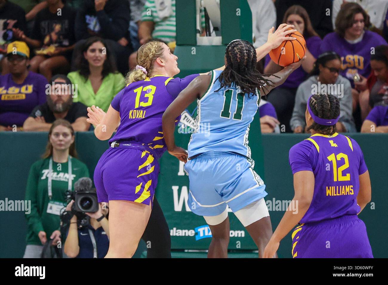 LSU Tigers forward Kate Koval (13) blocks Tulane Green Wave guard Jayda ...