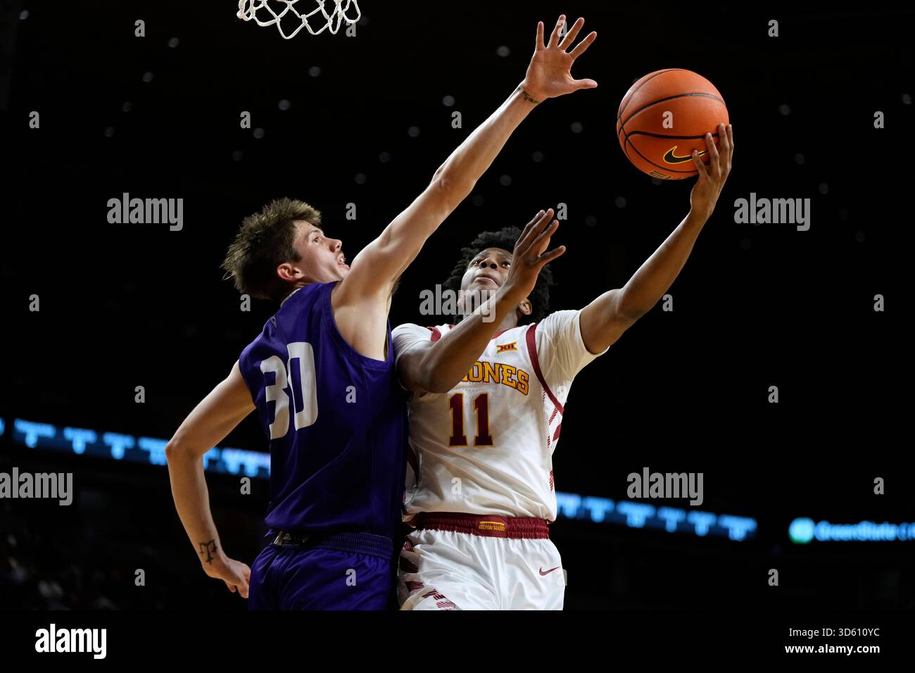 Iowa State guard Dominick Nelson (11) drives to the basket against ...