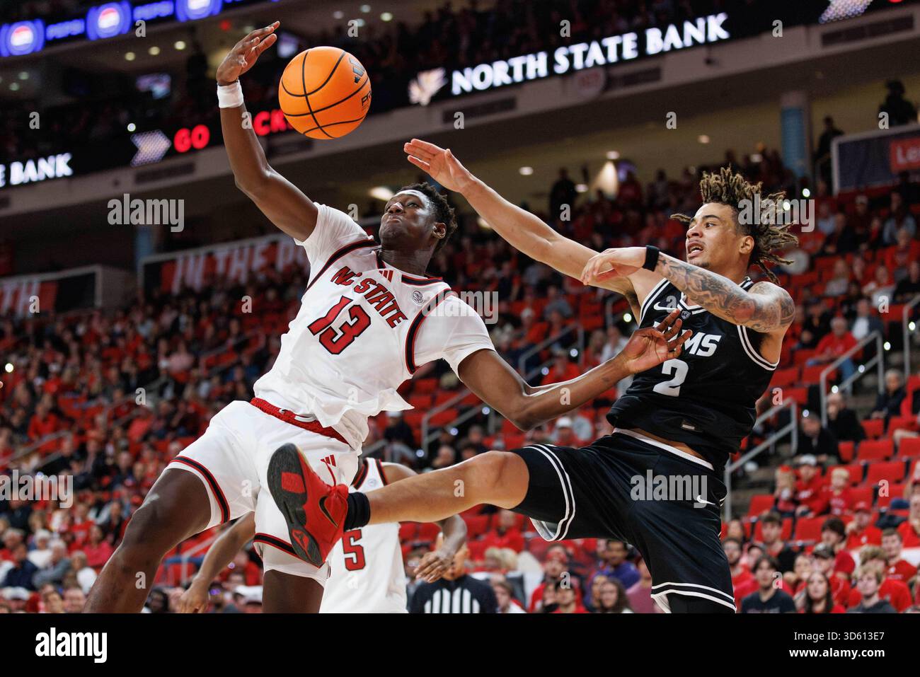 North Carolina State's Musa Sagnia (13) and Virginia Commonwealth's ...