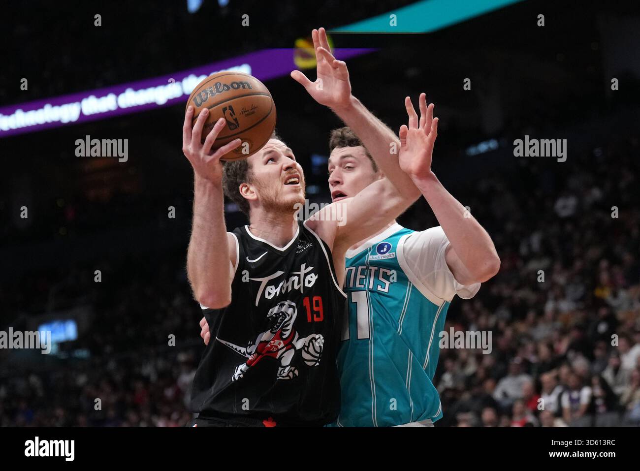Toronto Raptors center Jakob Poeltl (19) drives to the basket as ...