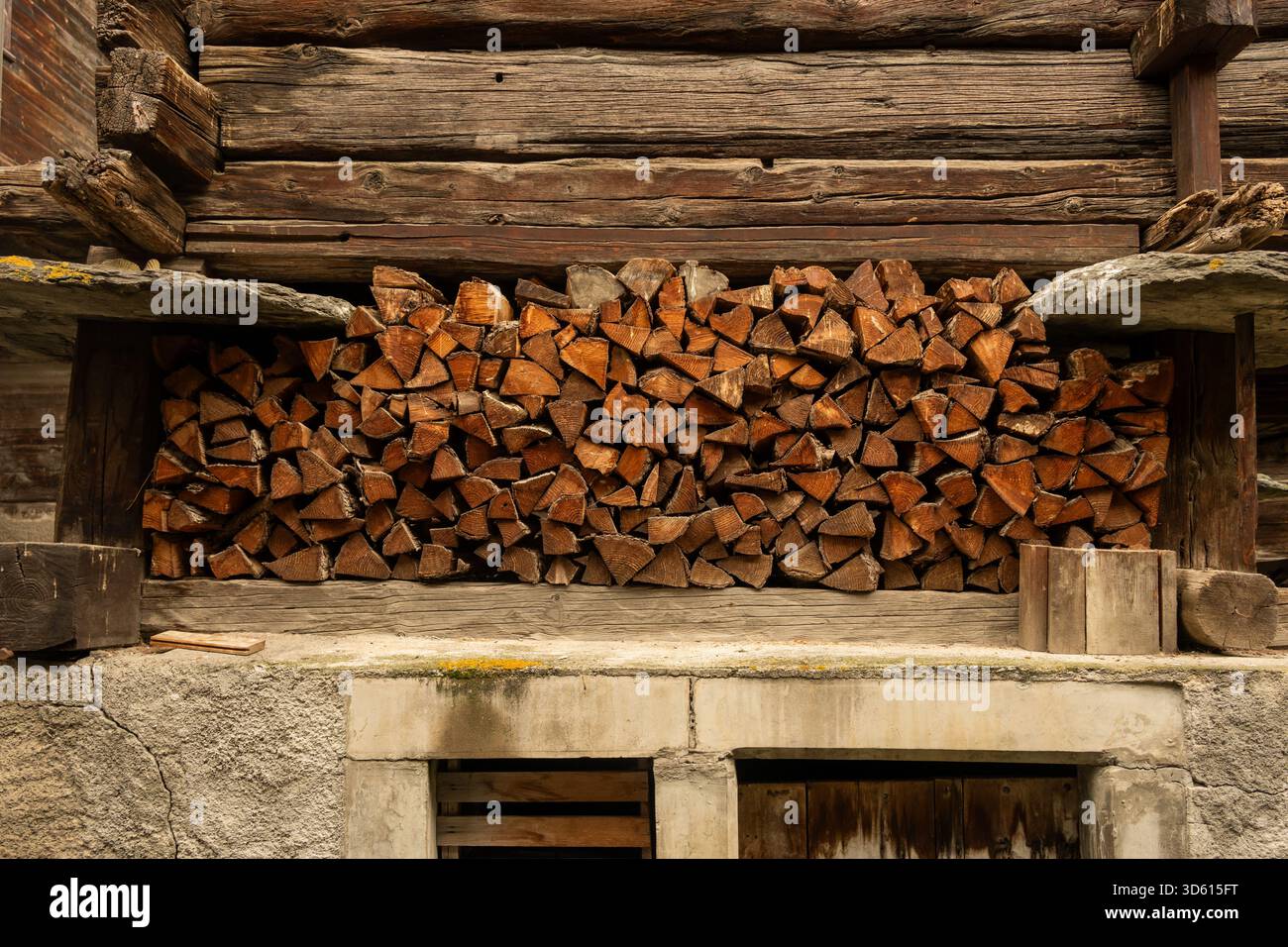 Split Fire Wood Stored Under Traditional Swiss Home in Valais region ...