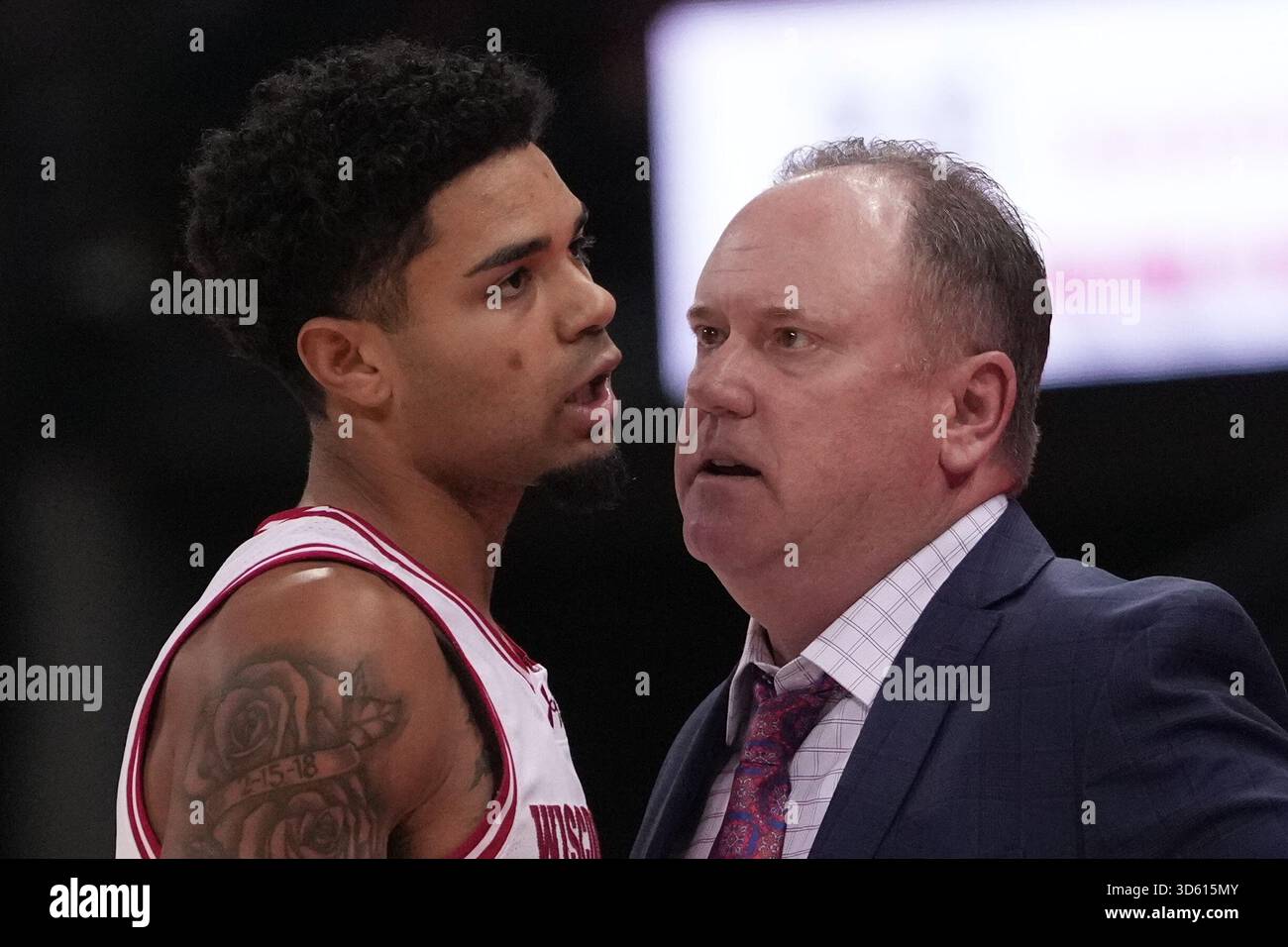 Wisconsin head coach Greg Gard talks to Nick Boyd during the second ...