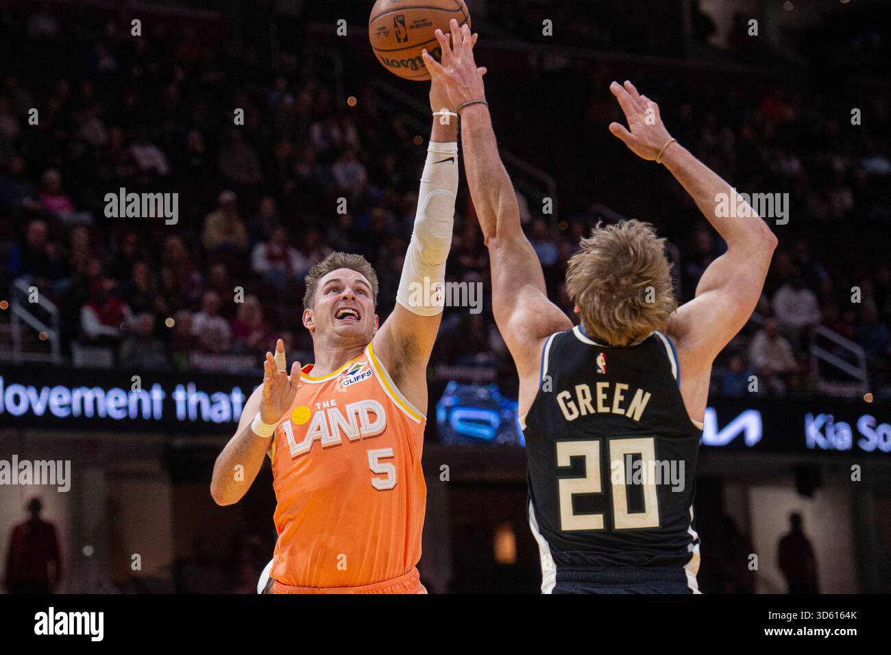 Cleveland Cavaliers' Sam Merrill (5) shoots over Milwaukee Bucks' AJ ...