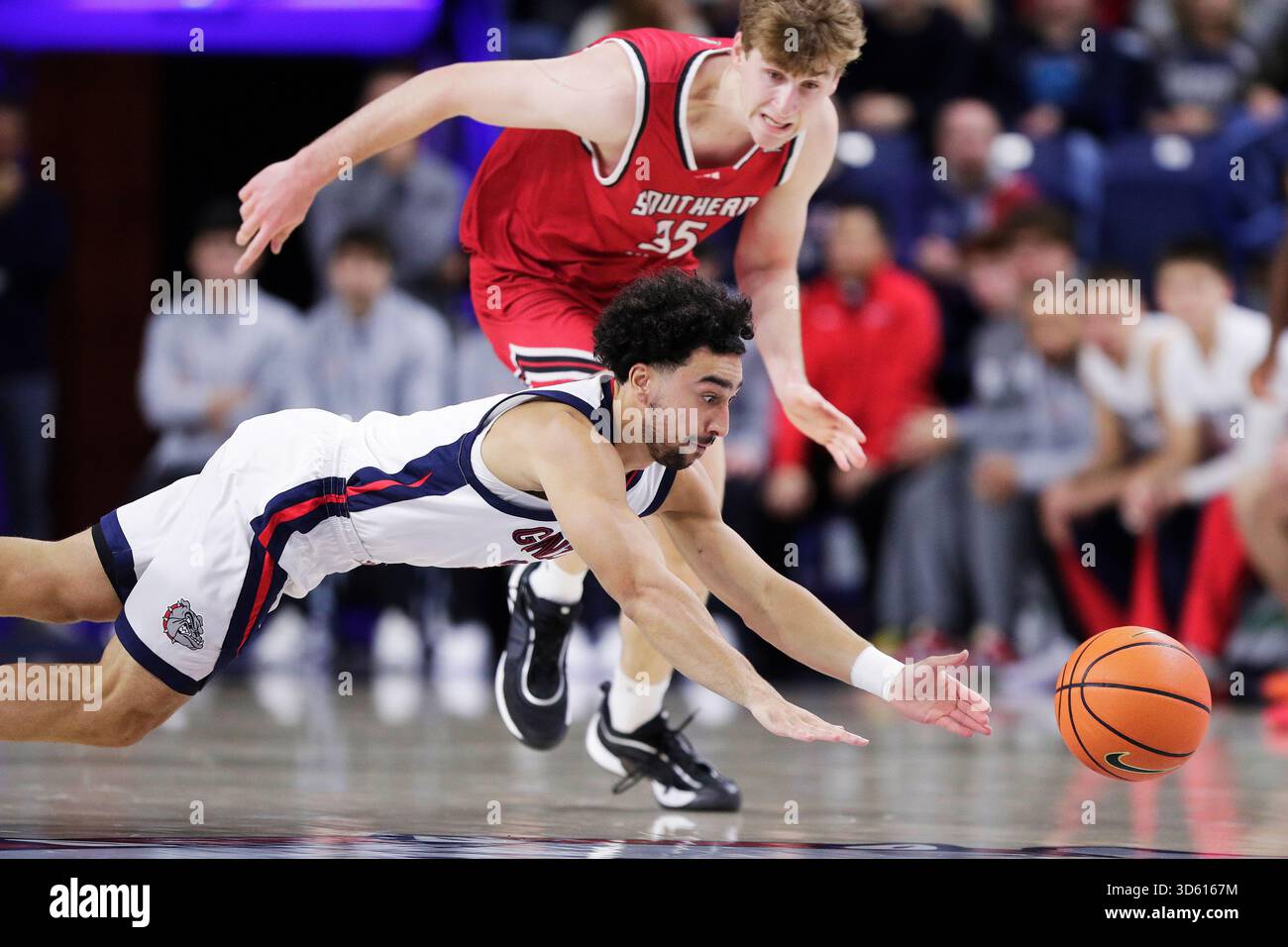 Gonzaga guard Braeden Smith, bottom, dives for the ball near Southern ...
