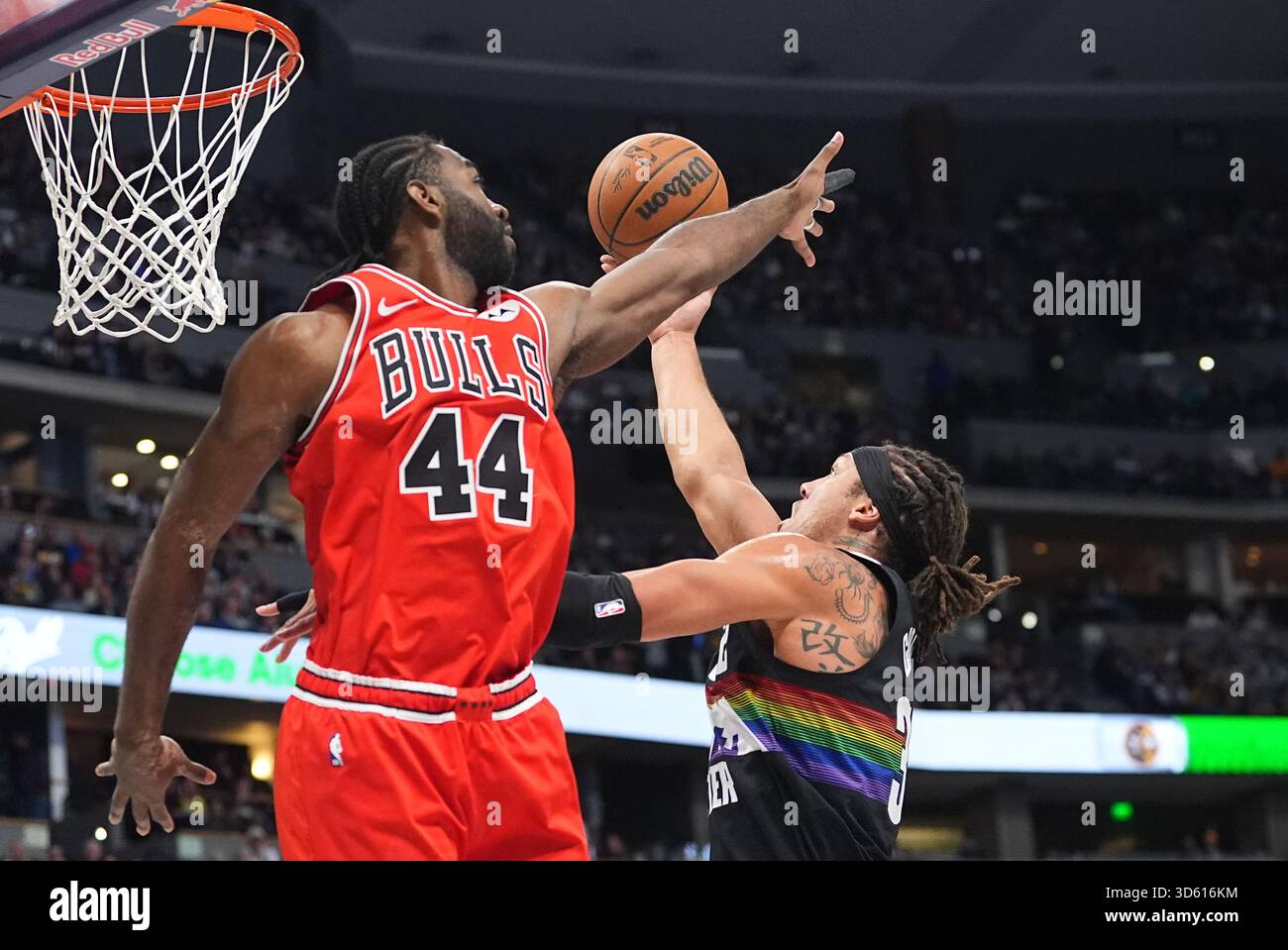 Denver Nuggets forward Aaron Gordon, right, drives to the basket as ...