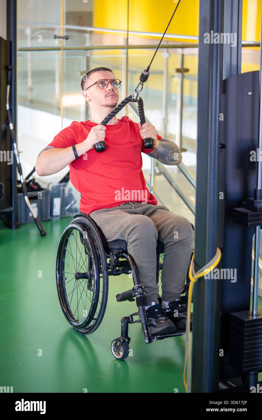 Motivated strong disabled man training upper body muscles with sports ...