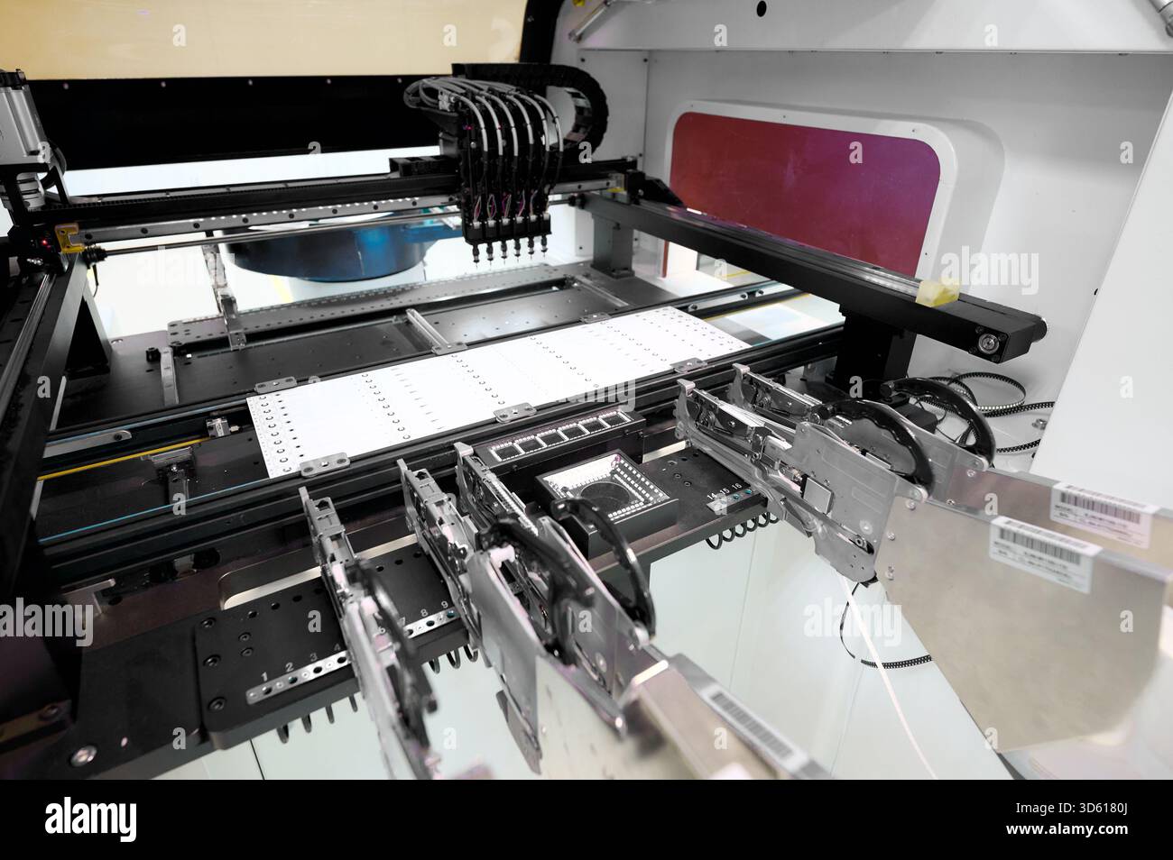SMT placement machine working on circuit board assembly in a modern ...