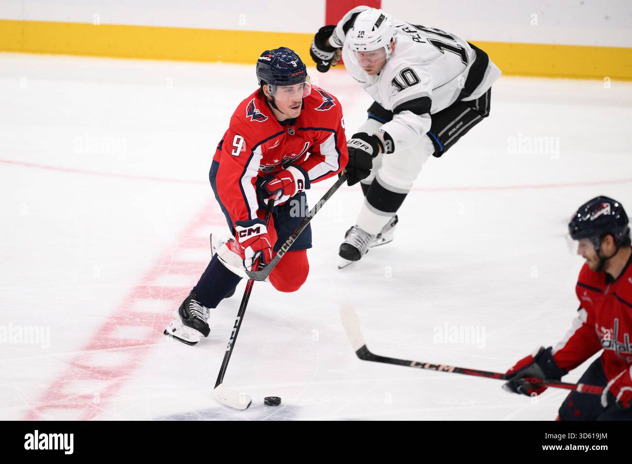 Washington Capitals right wing Ryan Leonard (9) skates with the puck ...