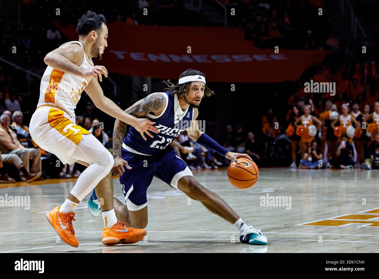 Rice guard Nick Anderson, right, drives as he is defended by Tennessee ...
