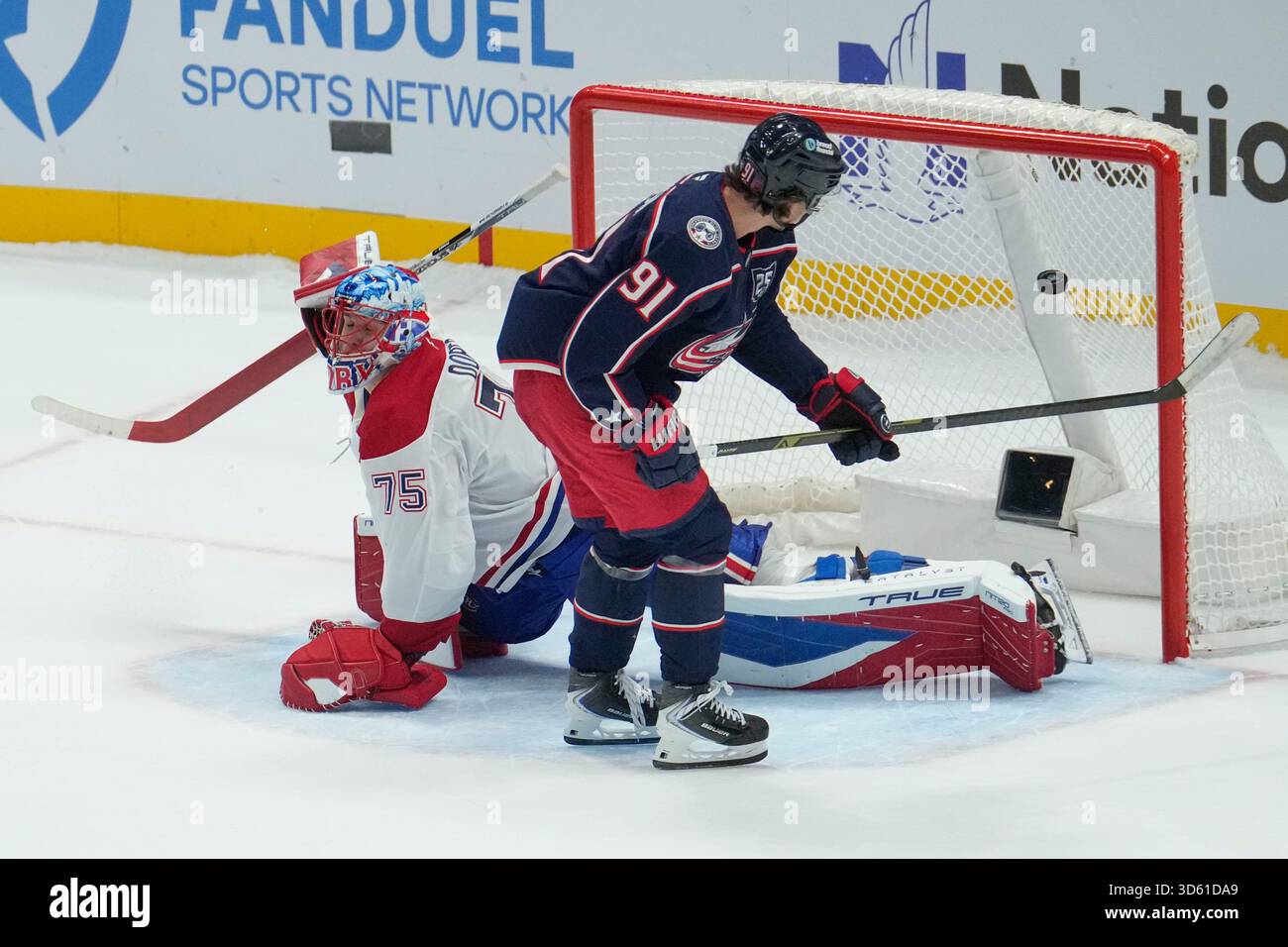 Columbus Blue Jackets center Kent Johnson (91) scores on Montreal ...