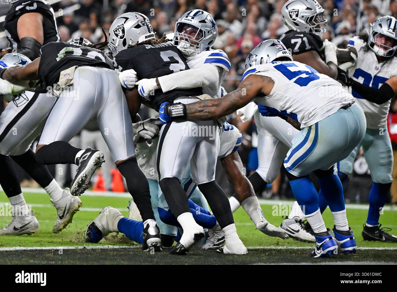 Dallas Cowboys defensive end Donovan Ezeiruaku, center, and Cowboys ...