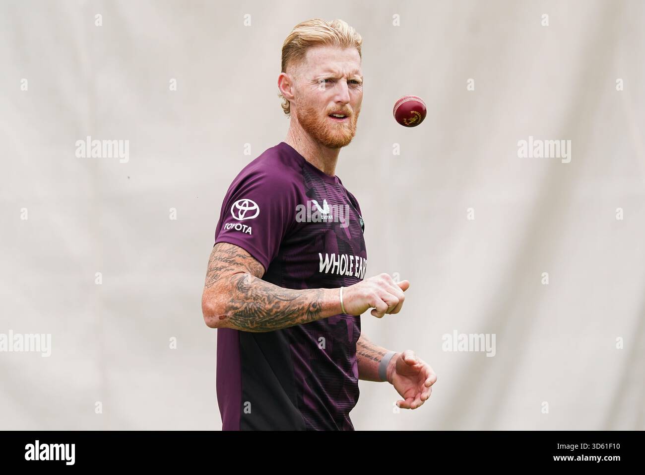 England’s Ben Stokes tosses a ball during a nets session at the Optus ...