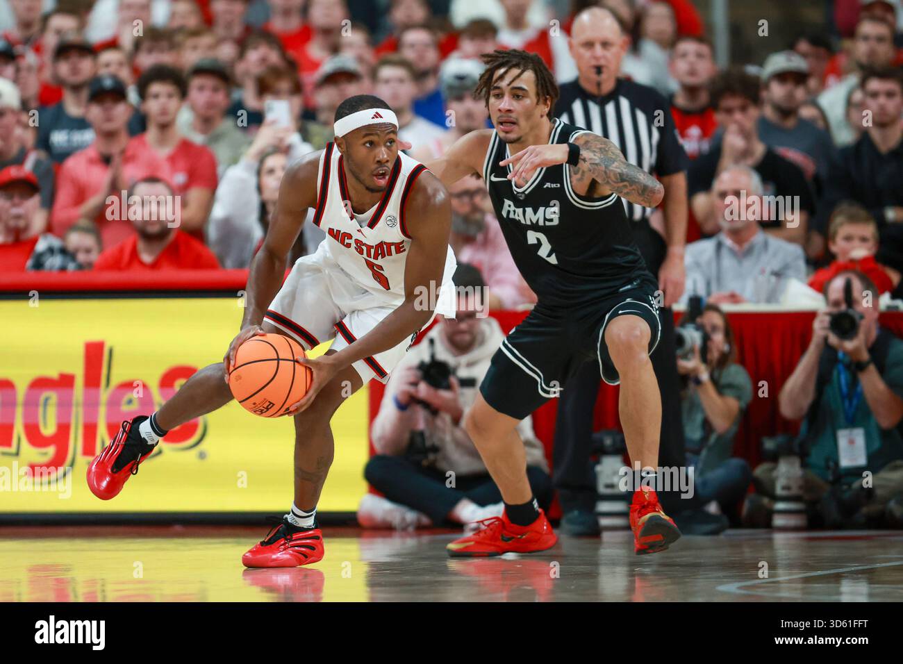 RALEIGH, NC - NOVEMBER 17: Tre Holloman #5 of the North Carolina State ...