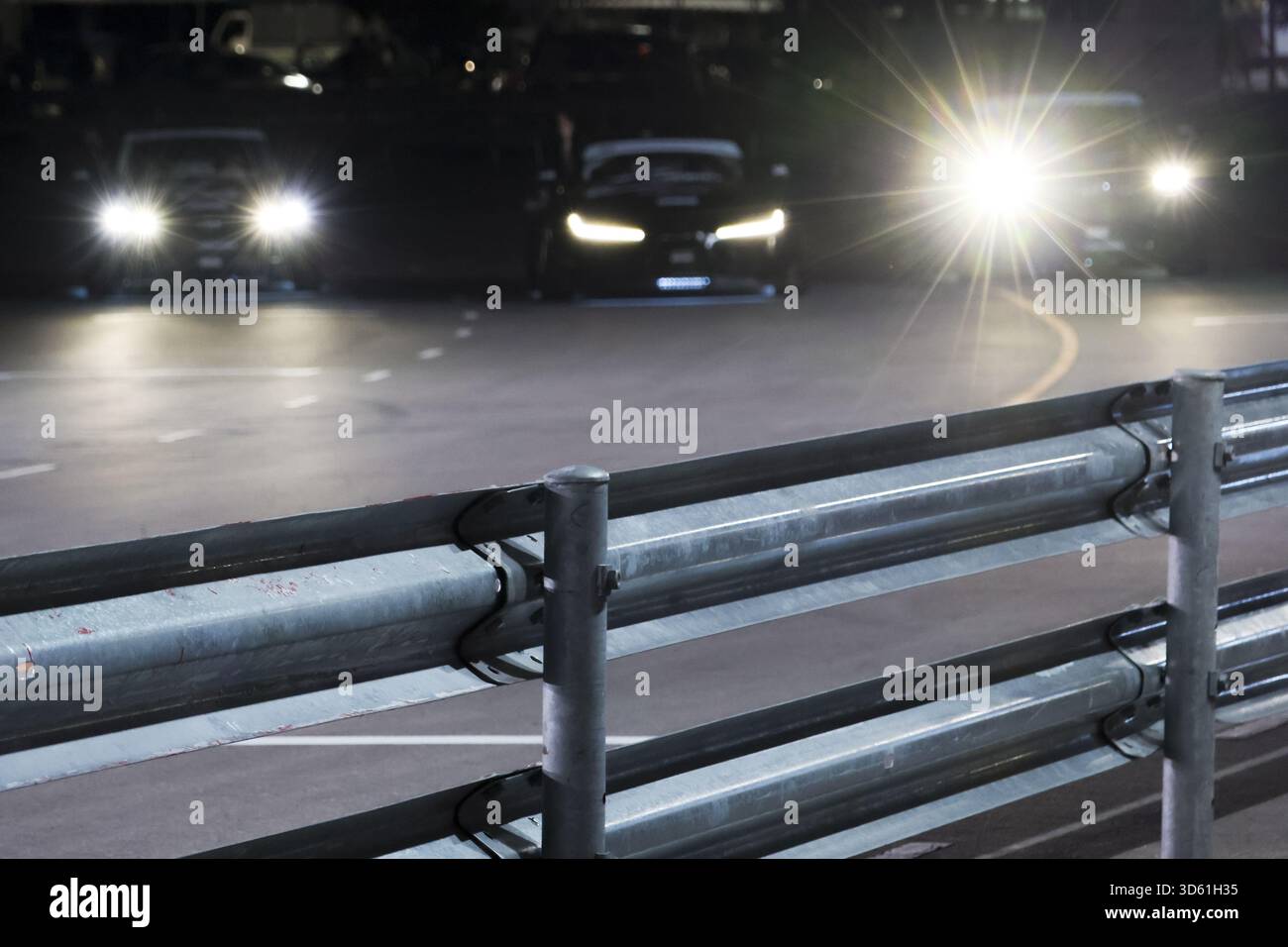 Dynamic automotive scene of modern cars driving at night. Bright ...