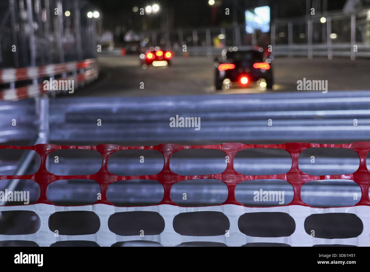 Thrilling night race on circuit with fast car in motion. view of ...