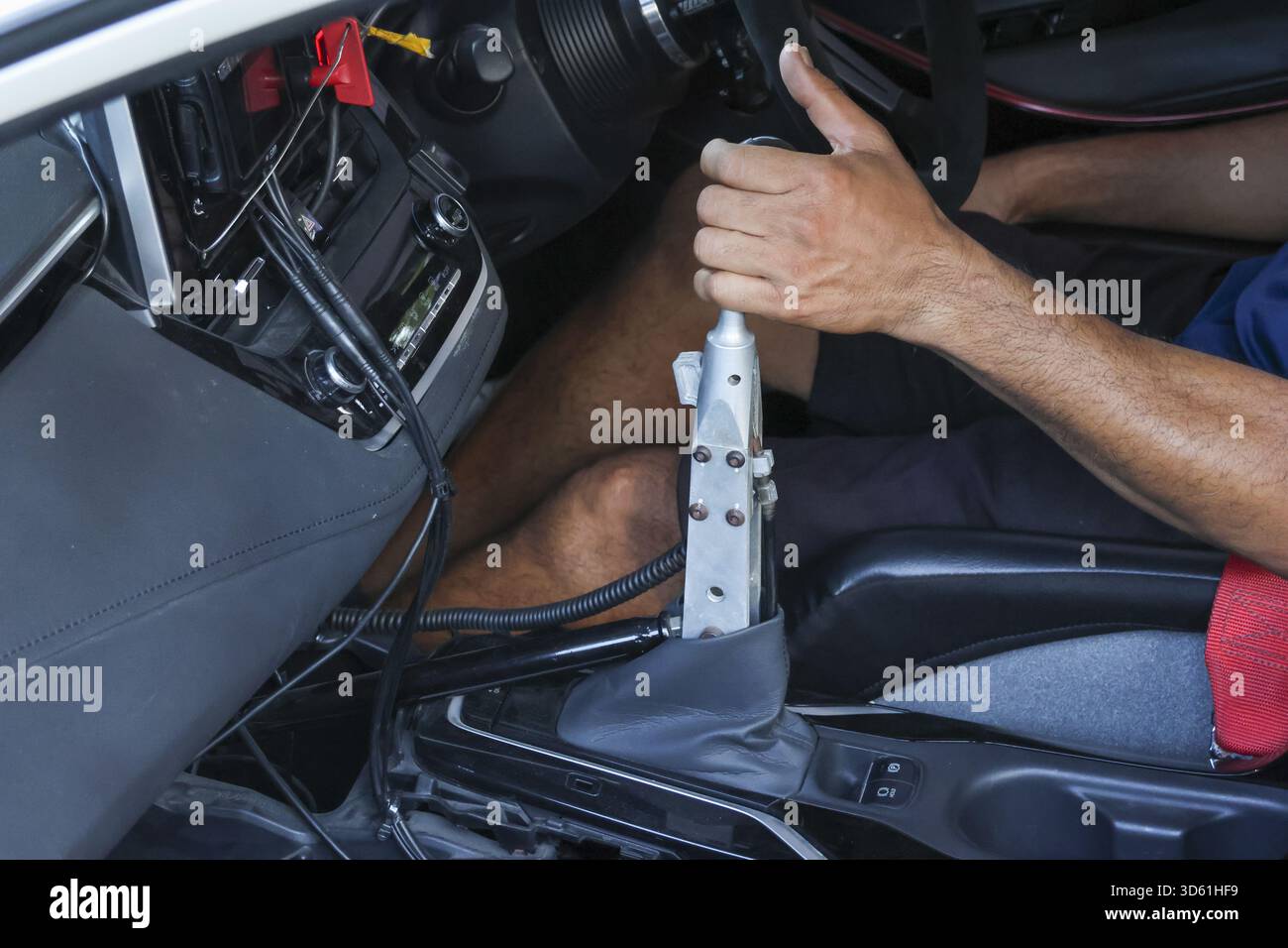 Man hand on custom gear stick inside performance car. focused driver ...