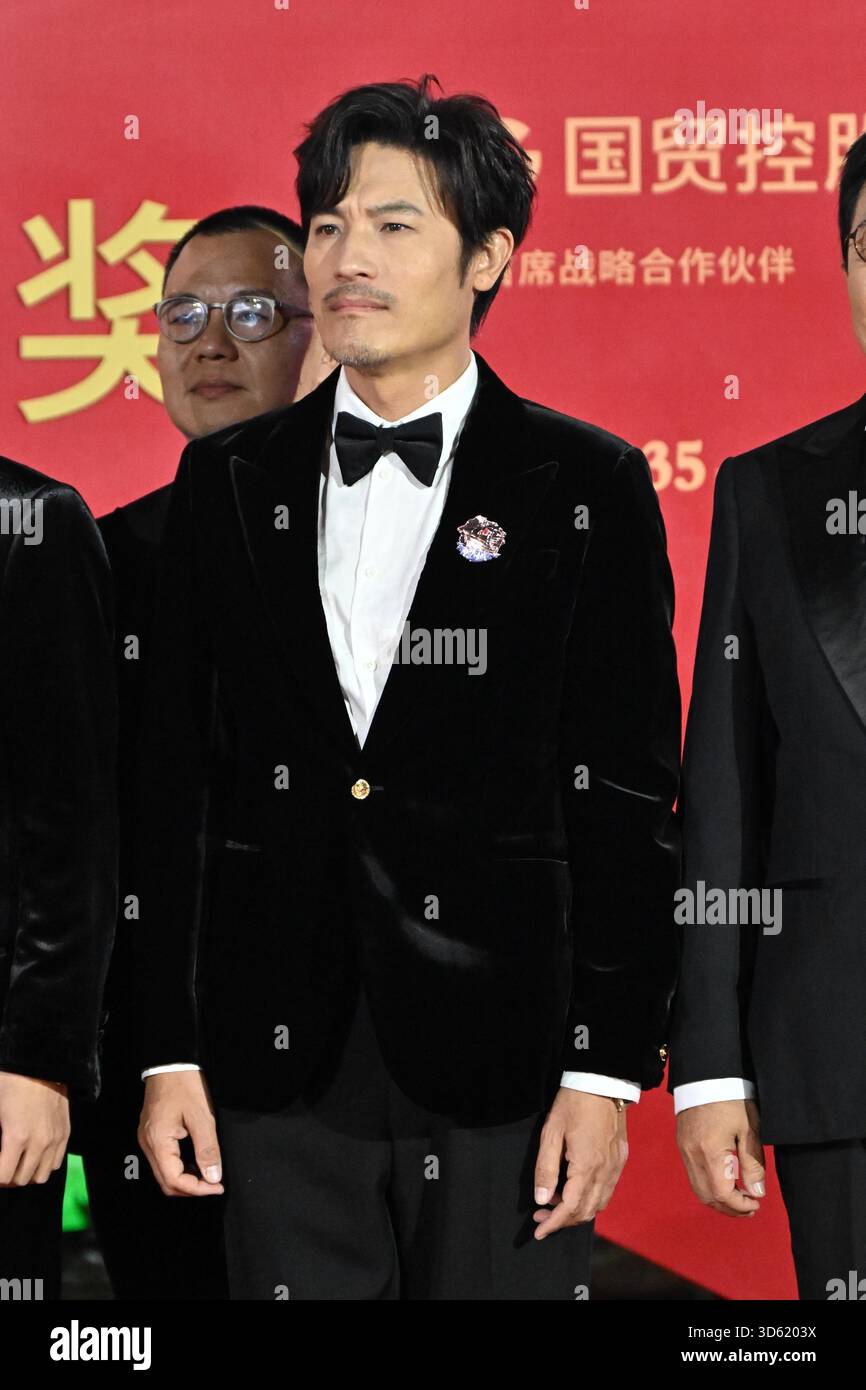 Chinese actor Geng Le poses for a photo on the red carpet at the ...