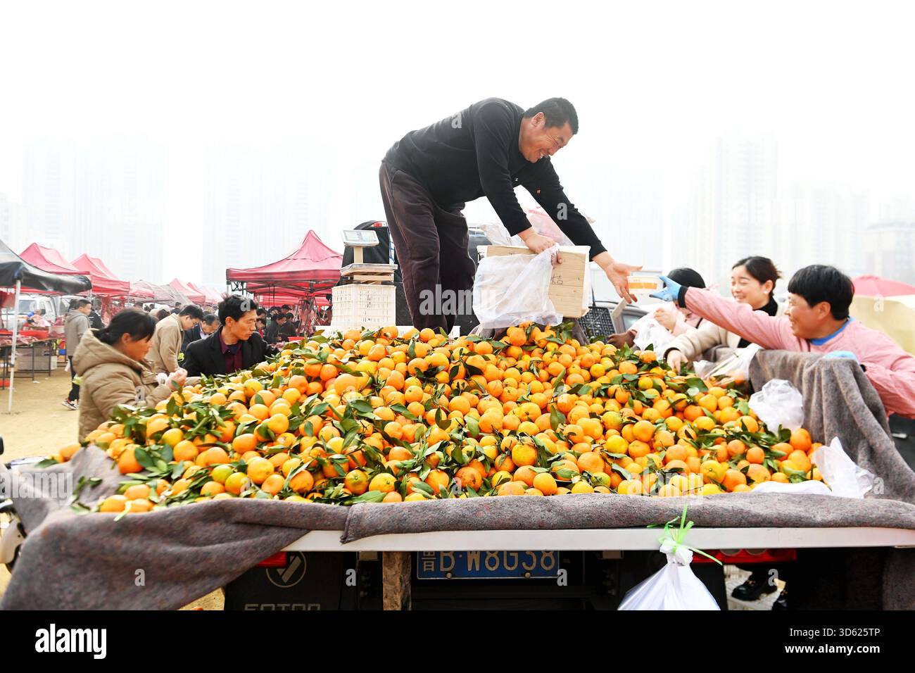 People shop at a country fair in Qingdao City, east China's Shandong ...