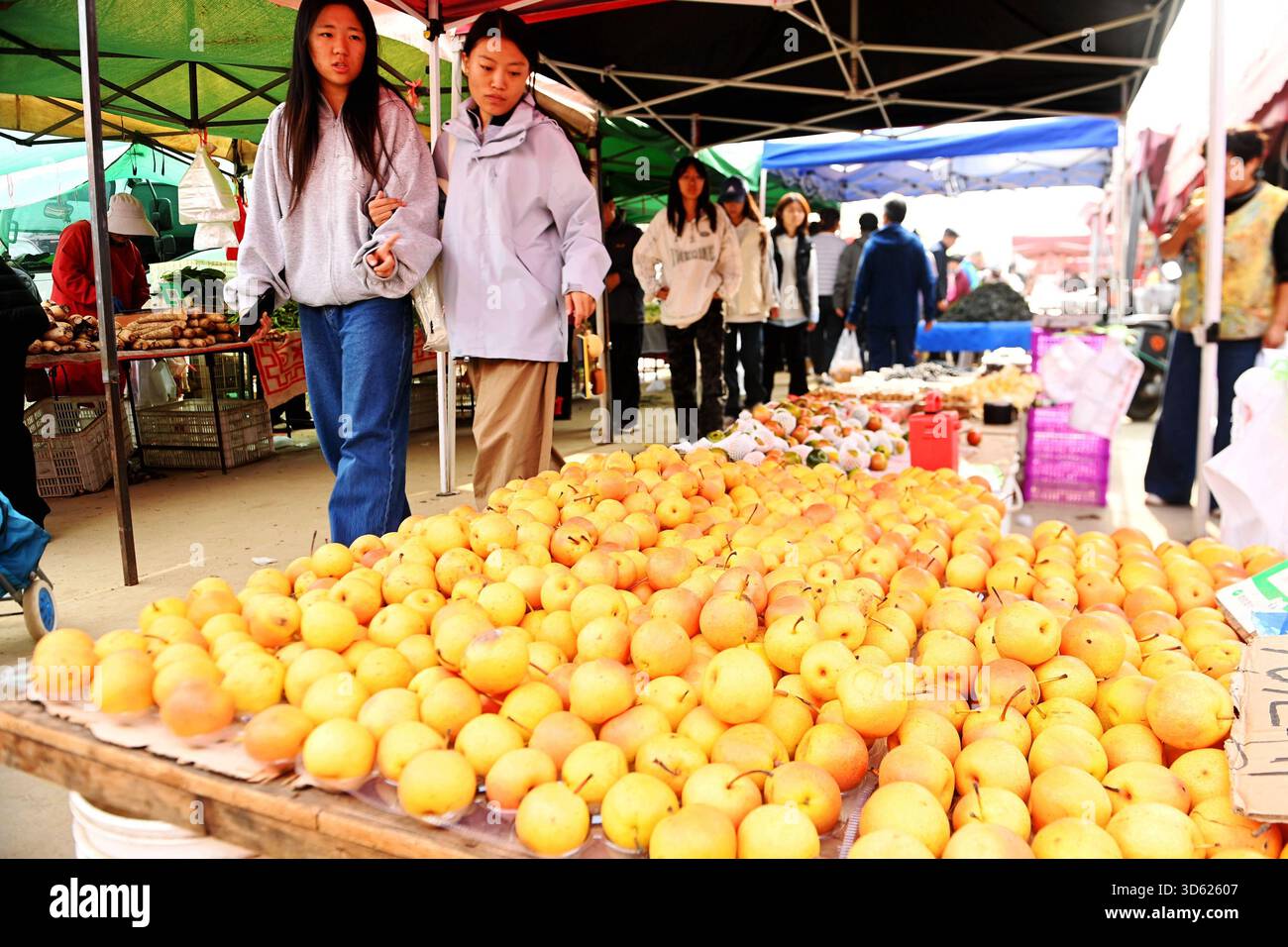 People shop at a country fair in Qingdao City, east China's Shandong ...