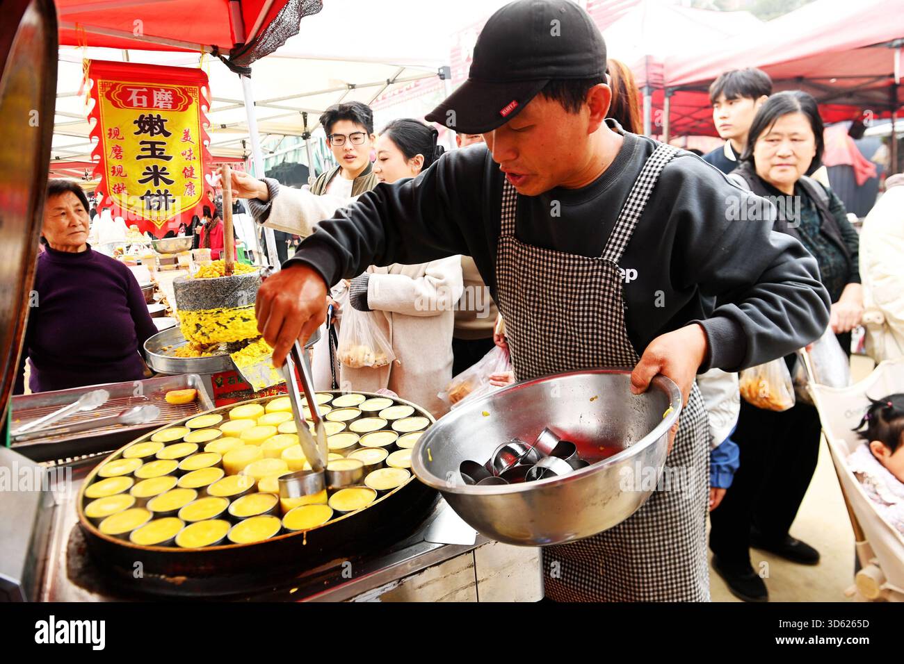 People shop at a country fair in Qingdao City, east China's Shandong ...