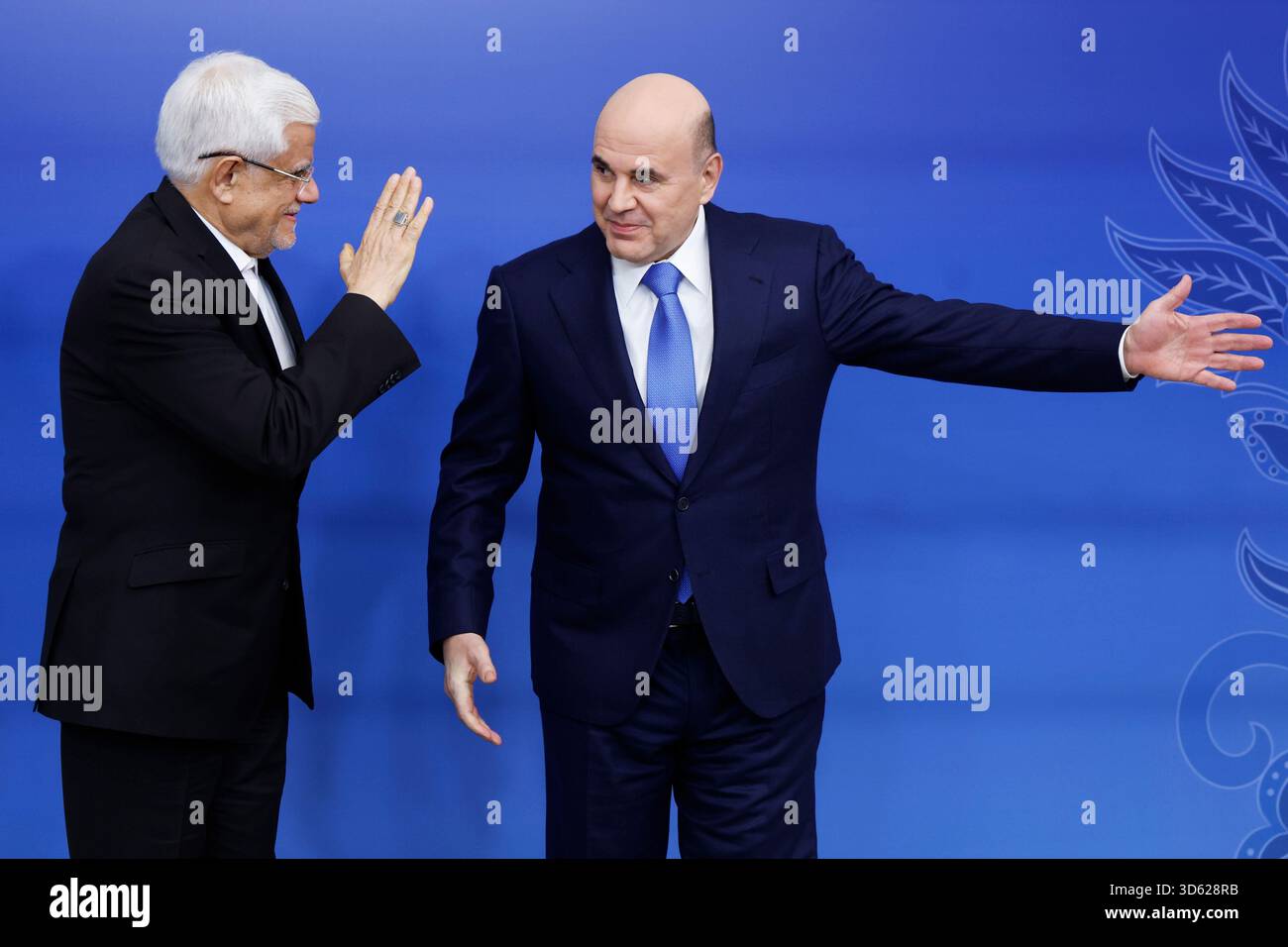 Russian Prime Minister Mikhail Mishustin, right, greets Iranian First ...