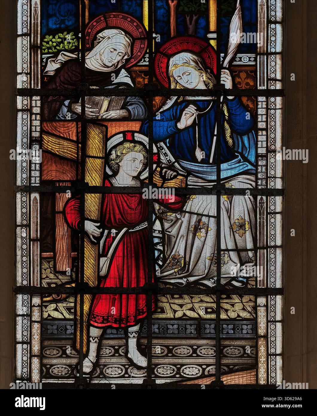 Stained glass window (of the boy Jesus Christ at work in his family ...