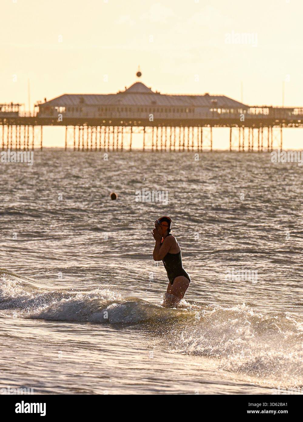 Brighton UK 18th November 2025 - A sea swimmer from the iSWIM club in ...