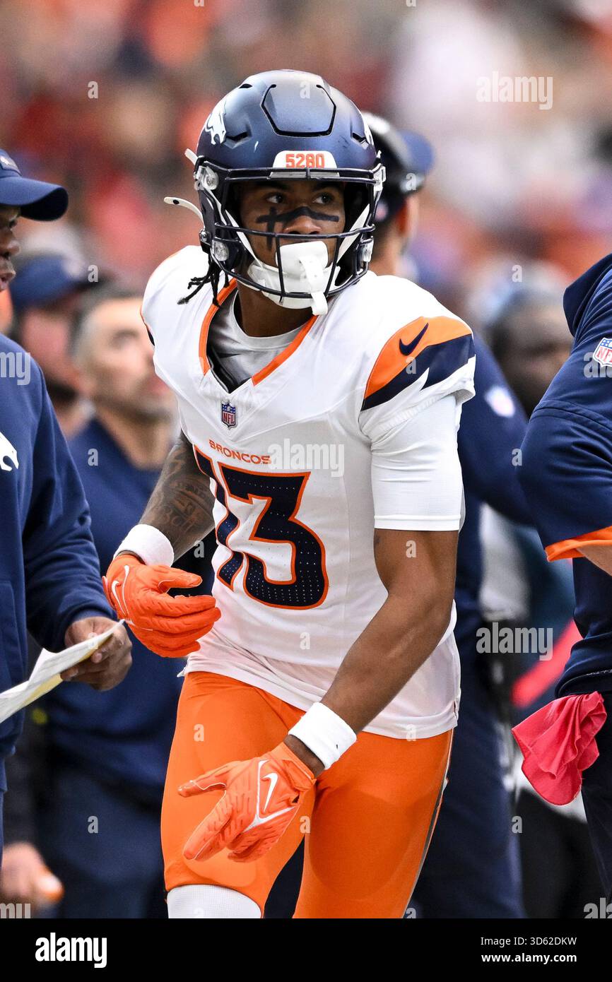 Denver Broncos wide receiver Pat Bryant (13) runs onto the field in the ...