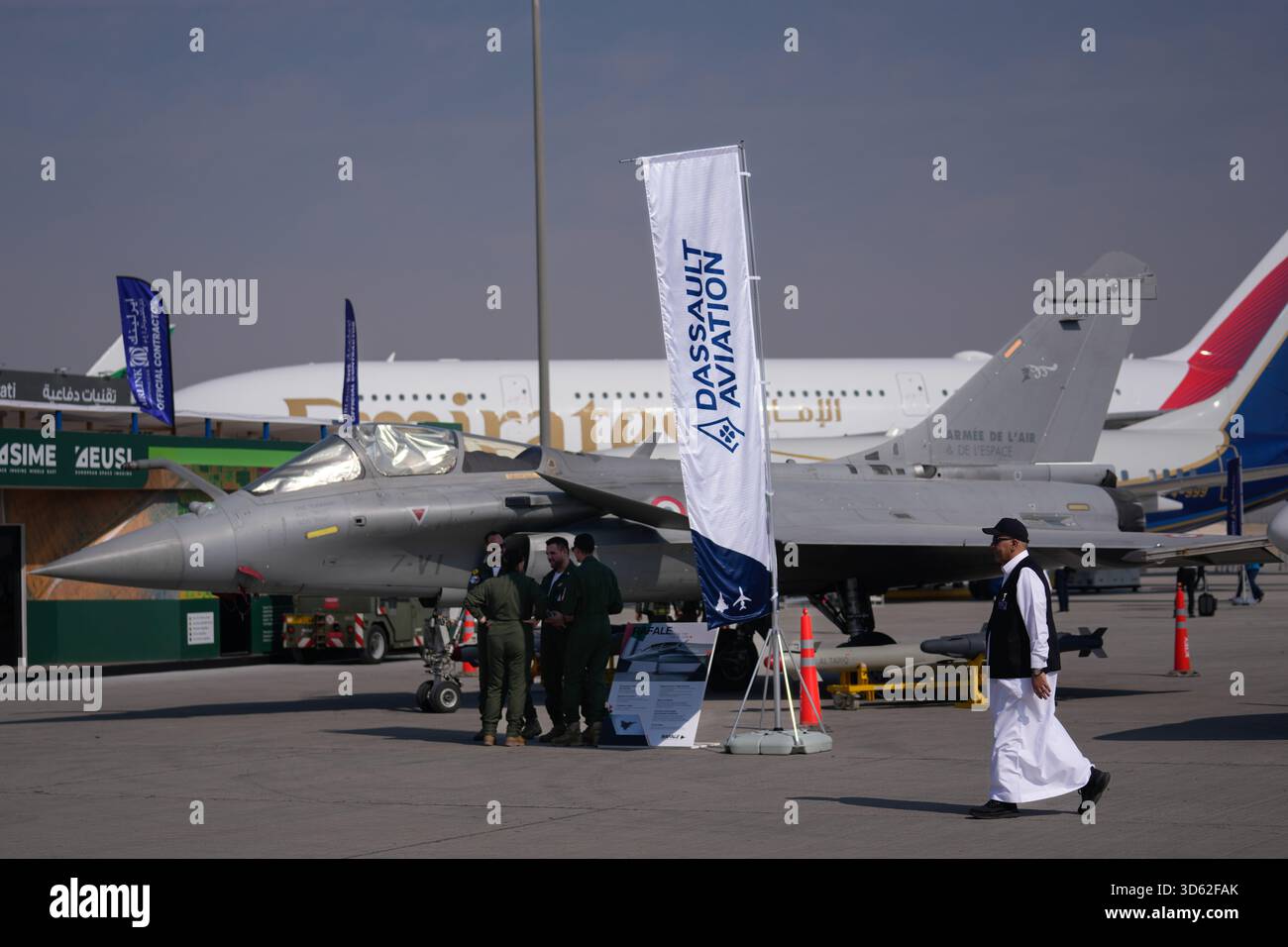 A man walks past a Rafael fighter jet at the Dubai Air Show, United ...