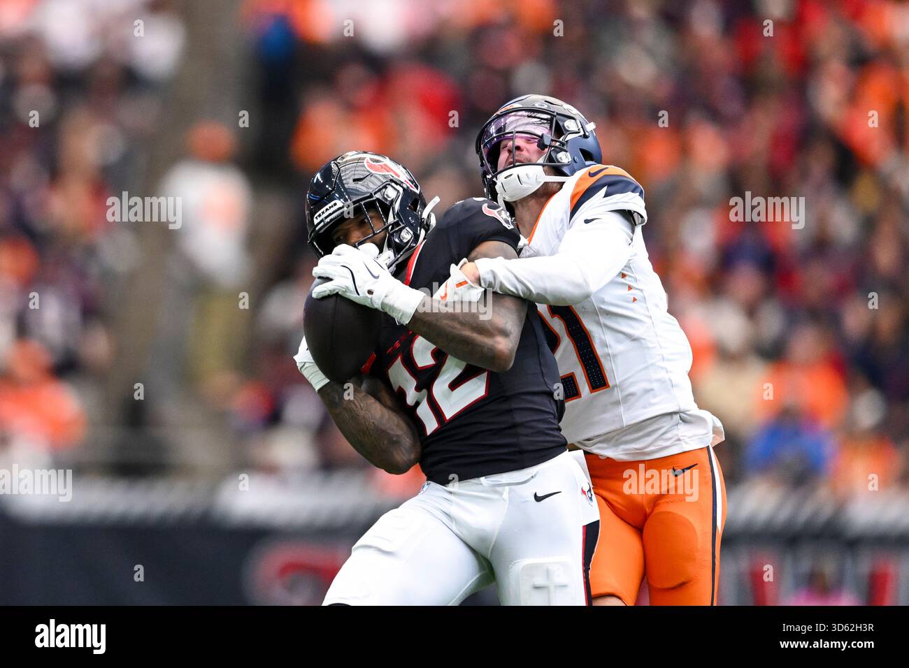 Houston Texans wide receiver Nico Collins (12) catches a pass as Denver ...