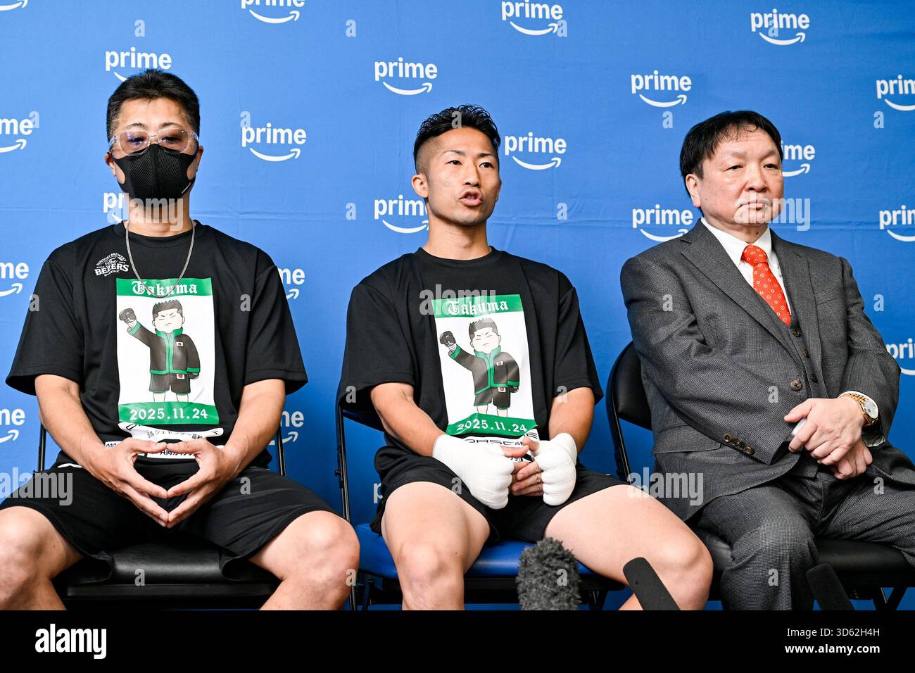 Takuma Inoue (C) of Japan talks to media with his trainer and father ...