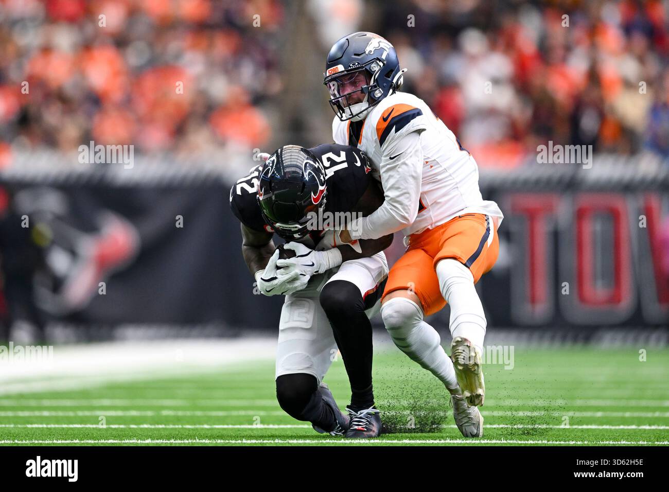 Houston Texans wide receiver Nico Collins (12) catches a pass as Denver ...