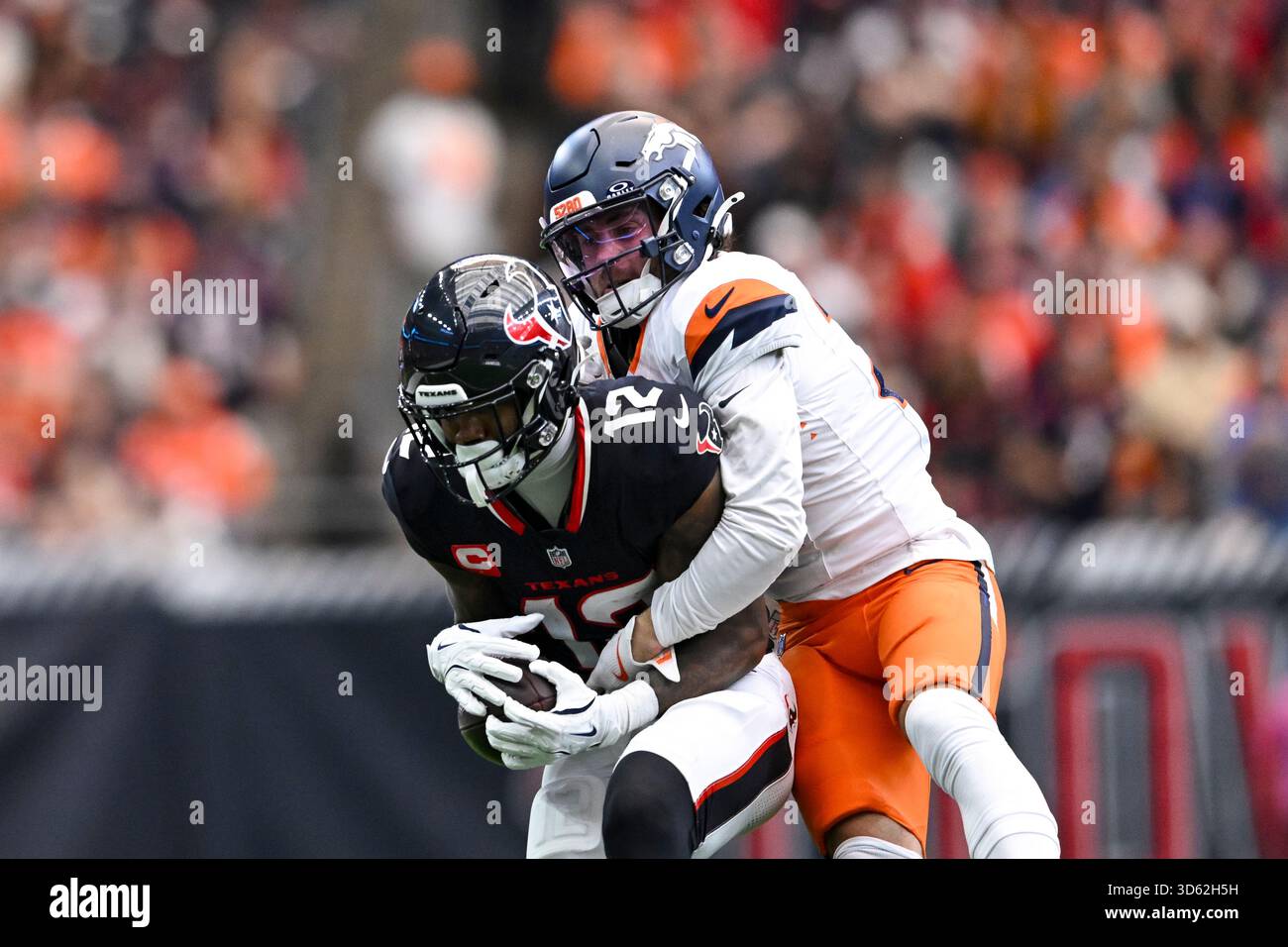 Houston Texans wide receiver Nico Collins (12) catches a pass as Denver ...
