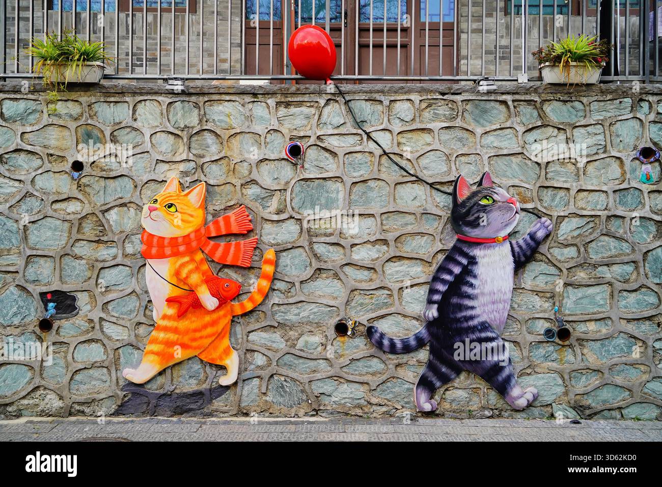Cat murals on the walls in Beijing, China, 15 November, 2025. (Photo by ...